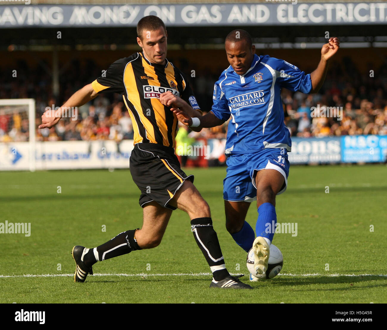 Dan Gleeson of Cambridge challenges Ishmael Welsh - Cambridge United vs ...