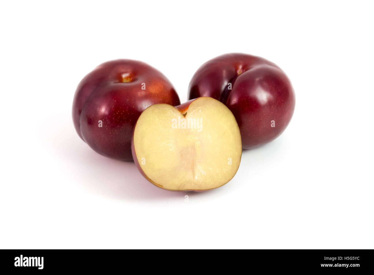 Prunes Plum fruit isolated on white Stock Photo - Alamy