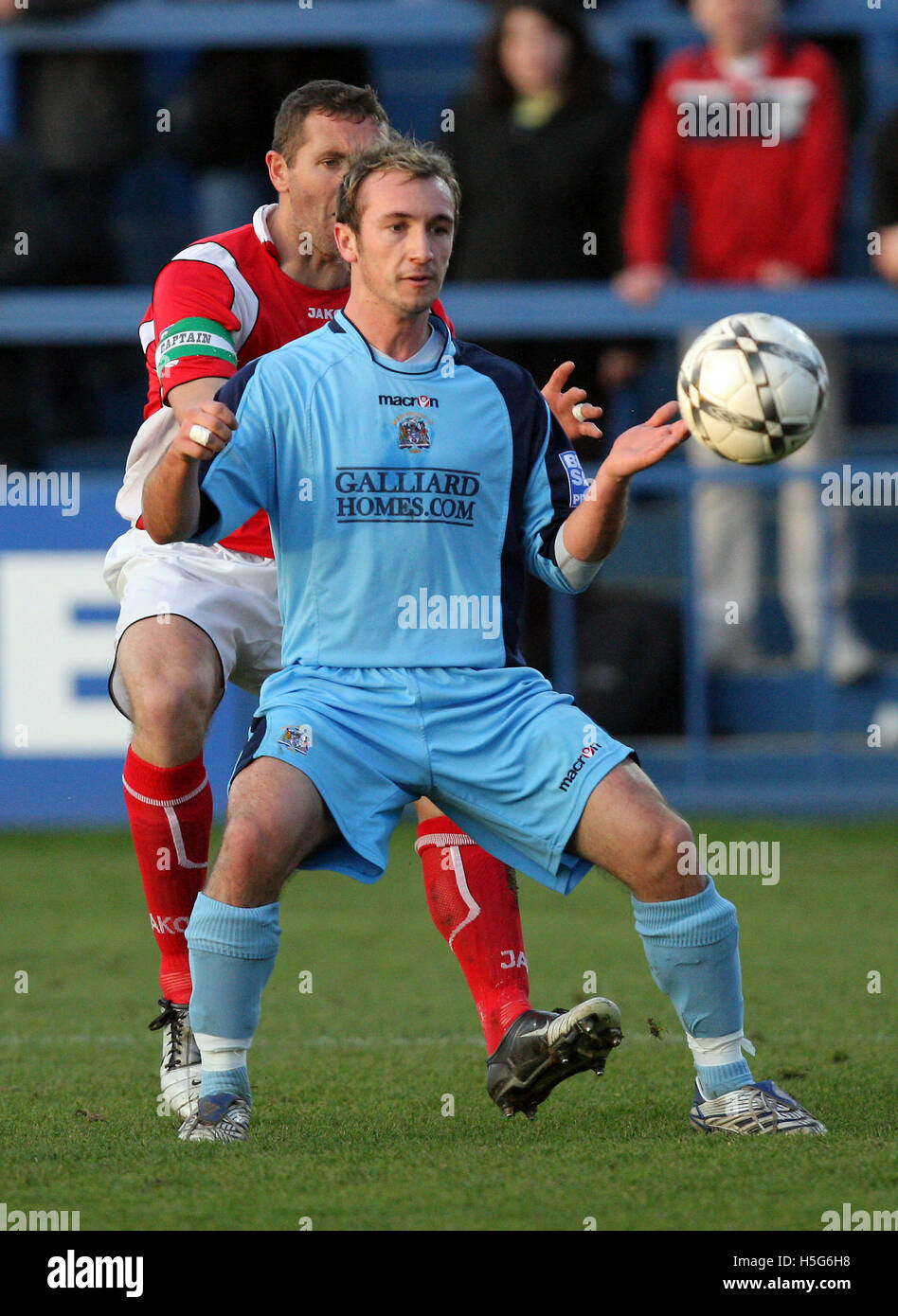 Ben Watson of Grays shields the ball from Peter Hawkins of Ebbsfleet ...