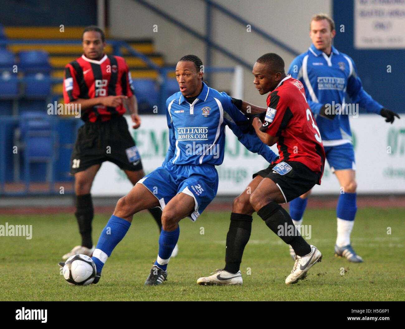 Wesley Thomas of Grays shields the ball from Patrick Ada of Histon ...