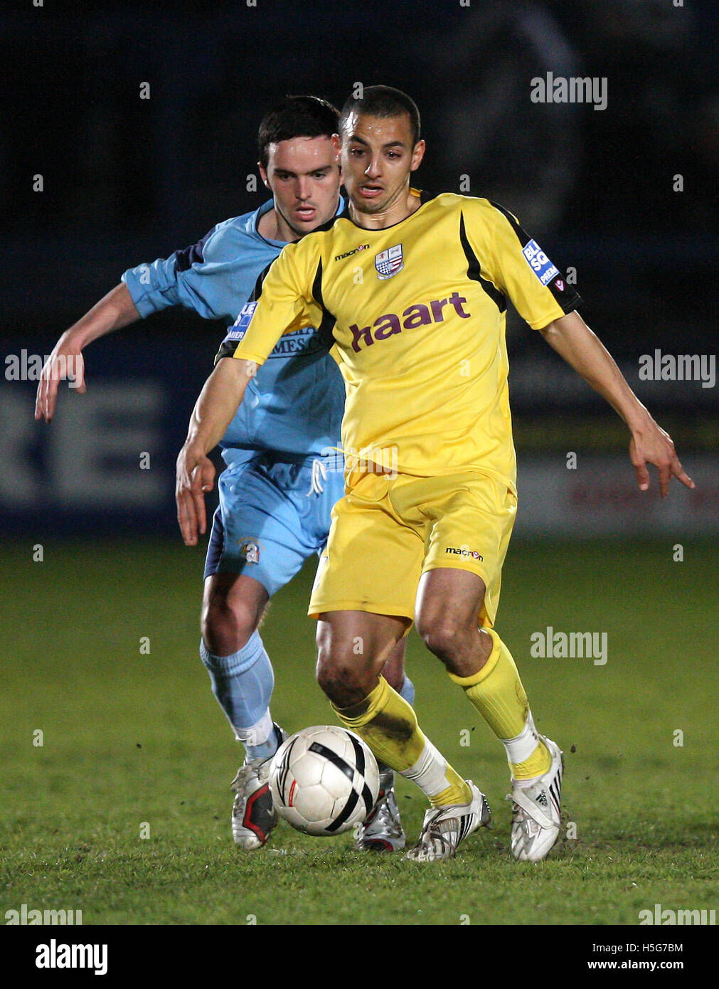 Abdou El Kholti of Rushden shields the ball from Neil McCafferty of ...