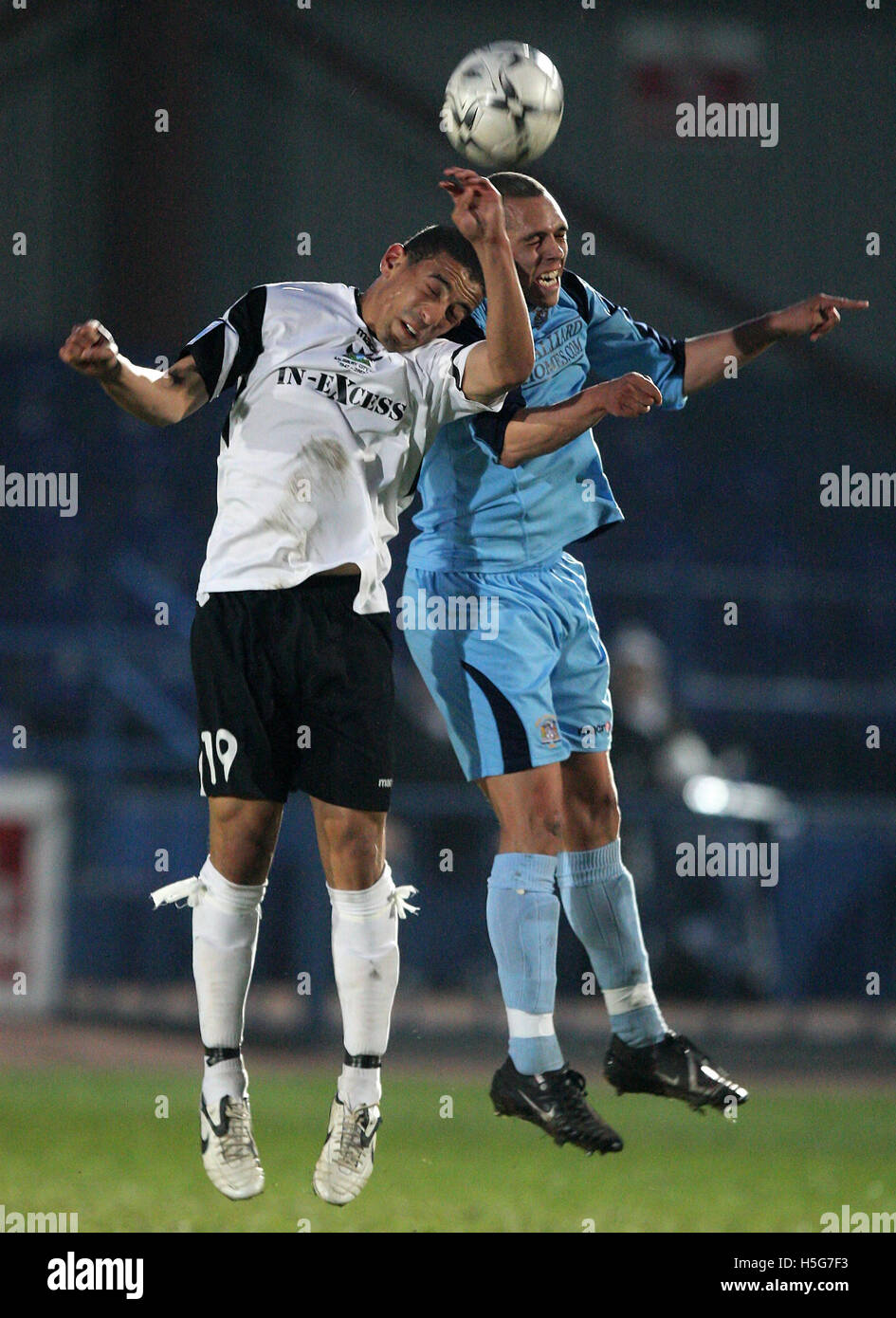 Liam Feeney of Salisbury (left) goes head to head with Cam Mawer of ...