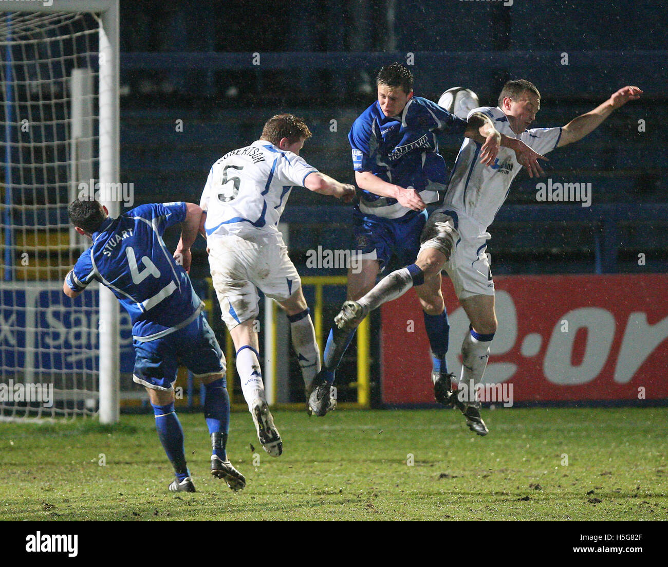 Jamie Stuart (L) and Andy Pugh of Grays take on Steve Woods (R) and ...