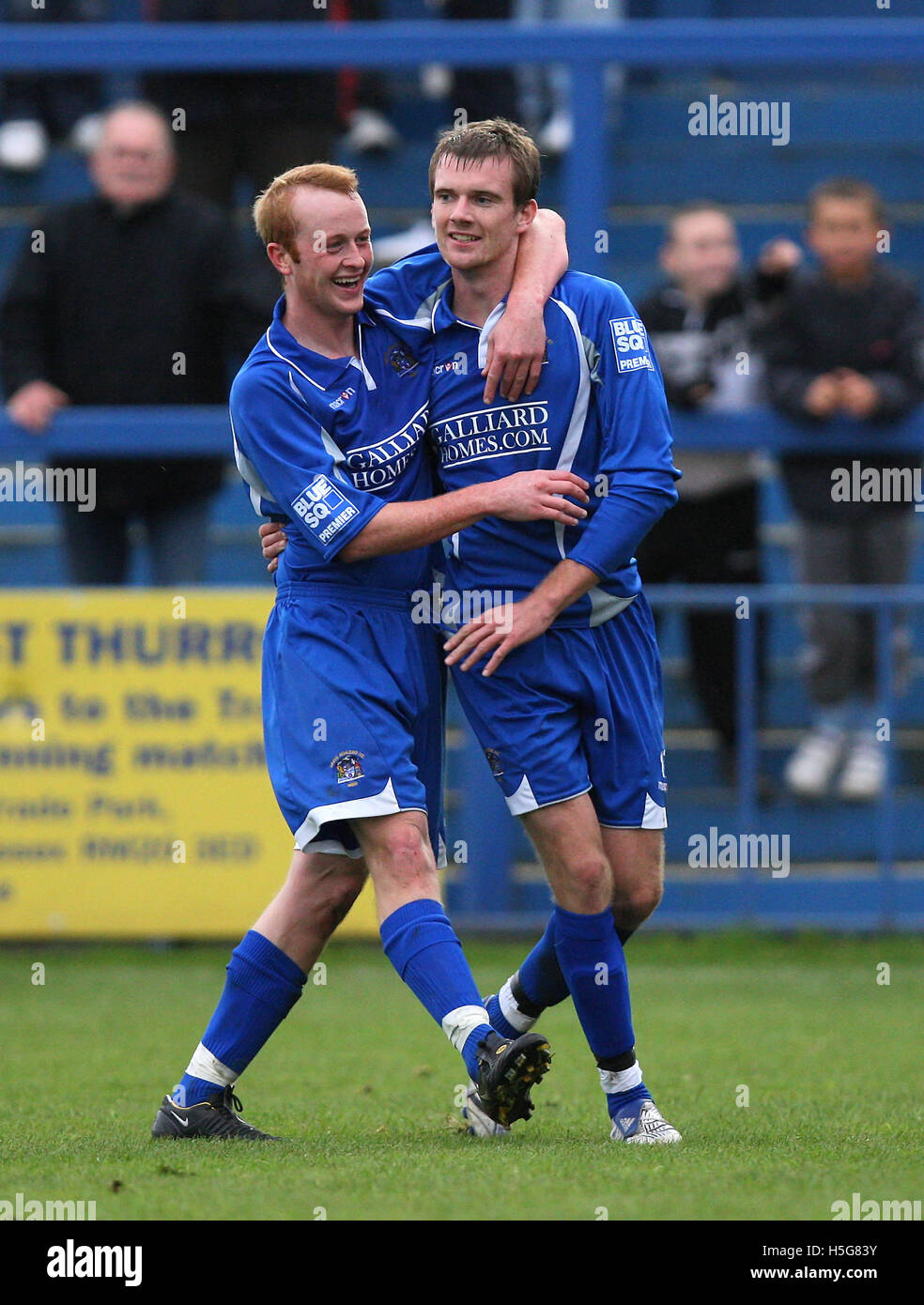 Kenny Davis congratulates Barry Cogan (R) on scoring the second goal ...