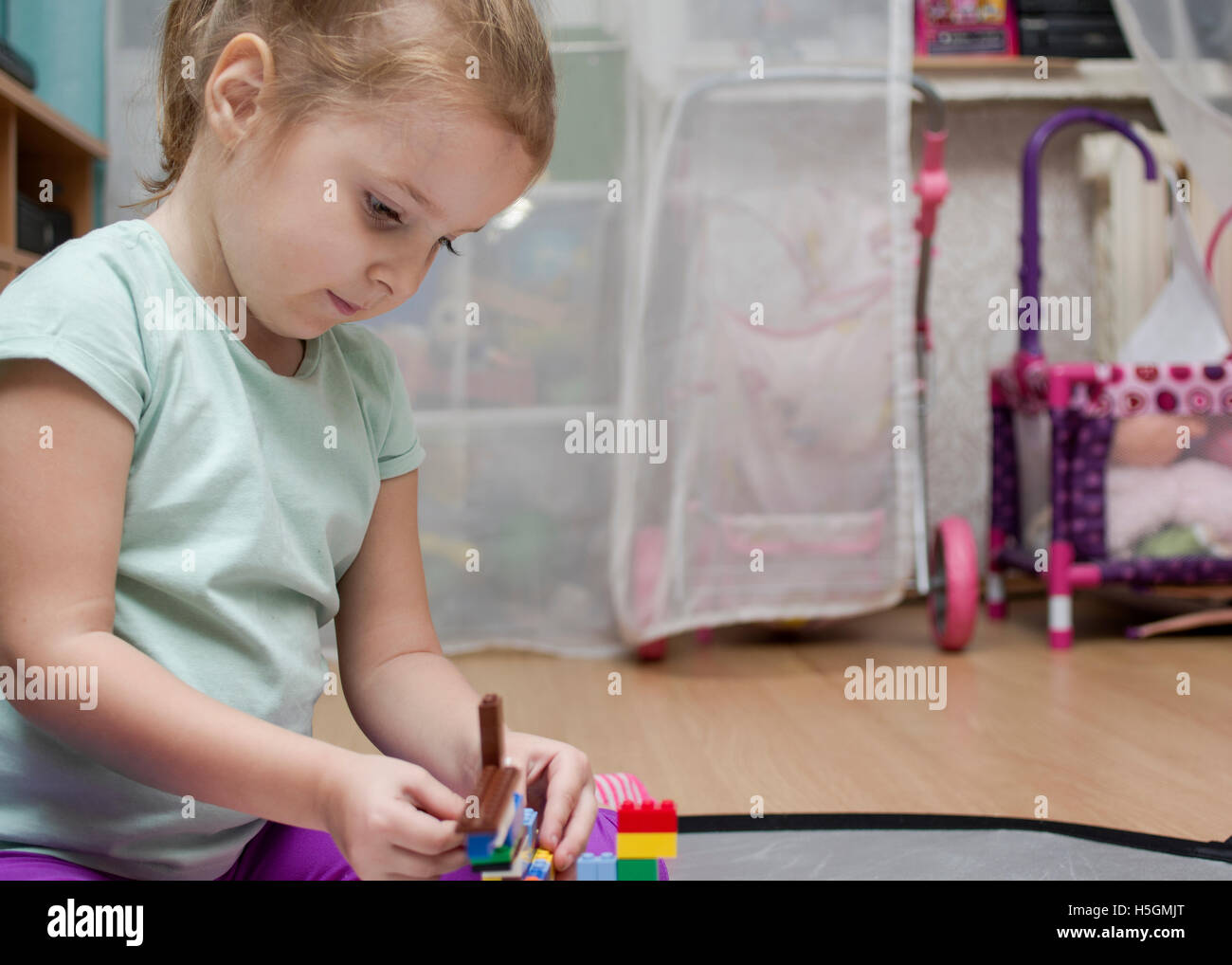 Girl Playing Alone Stock Photo - Alamy