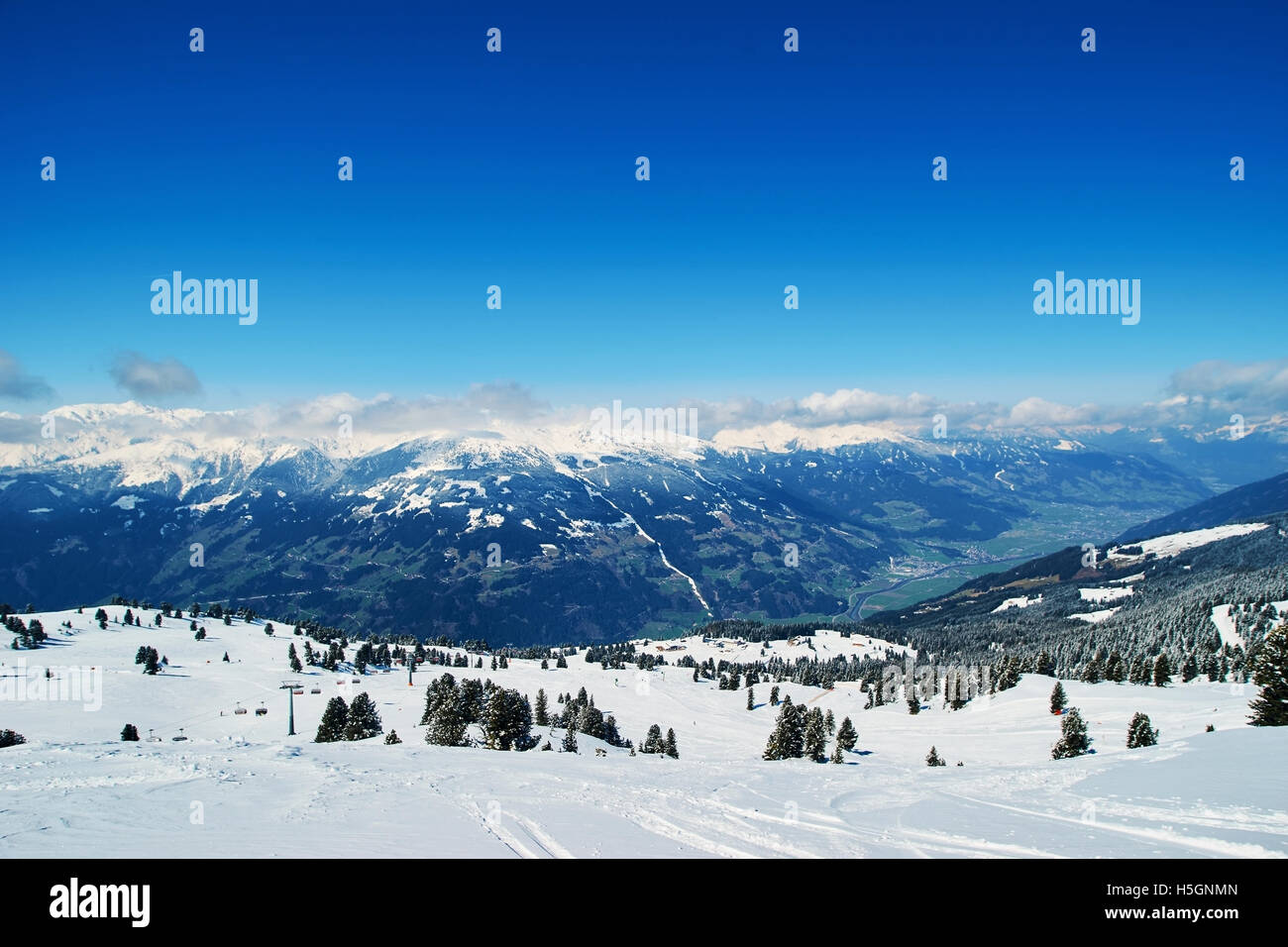 Snowy slopes in winter mountains. Skiing resorts Stock Photo - Alamy