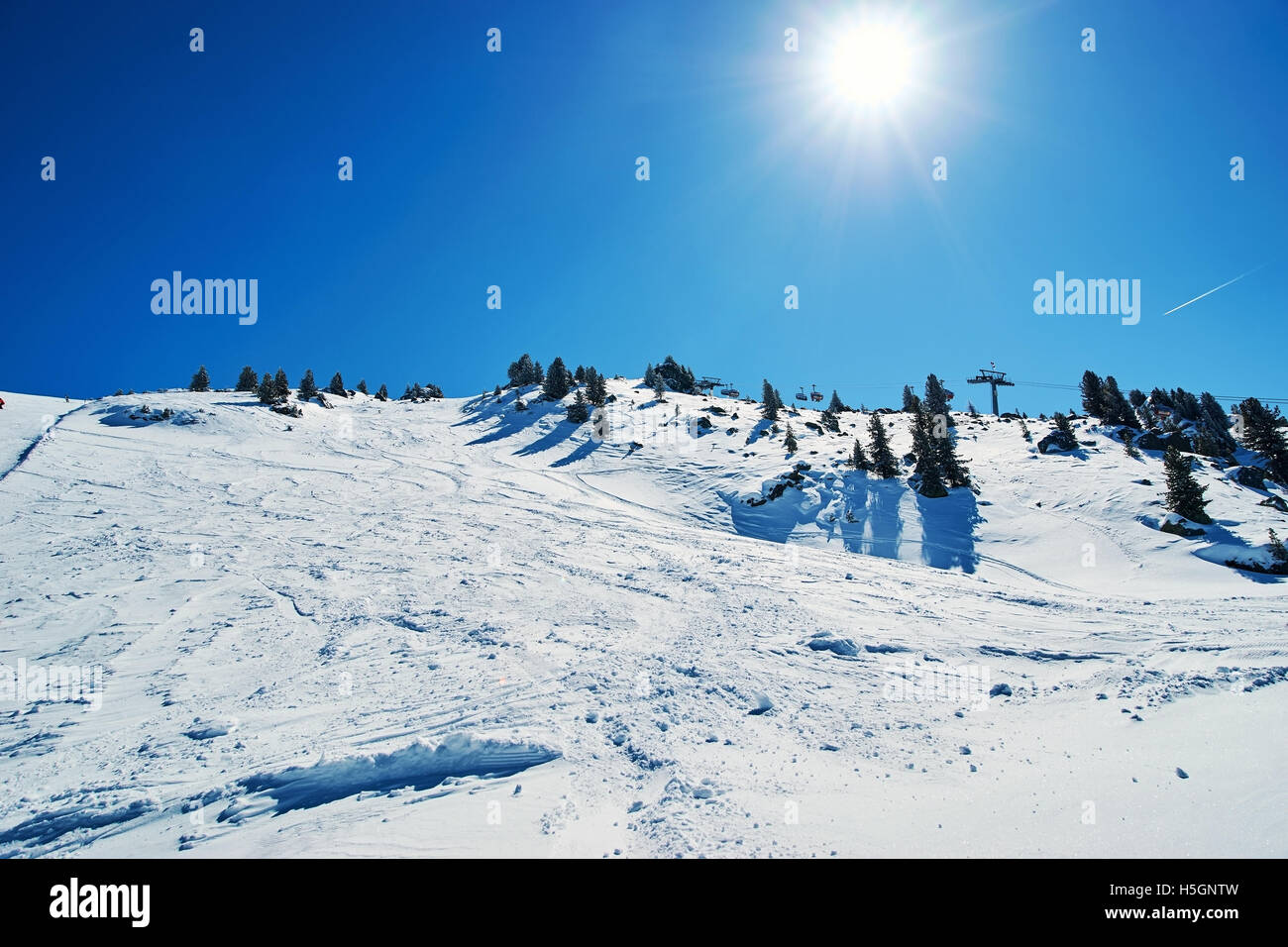 Snowy slopes in winter mountains. Skiing resorts Stock Photo - Alamy