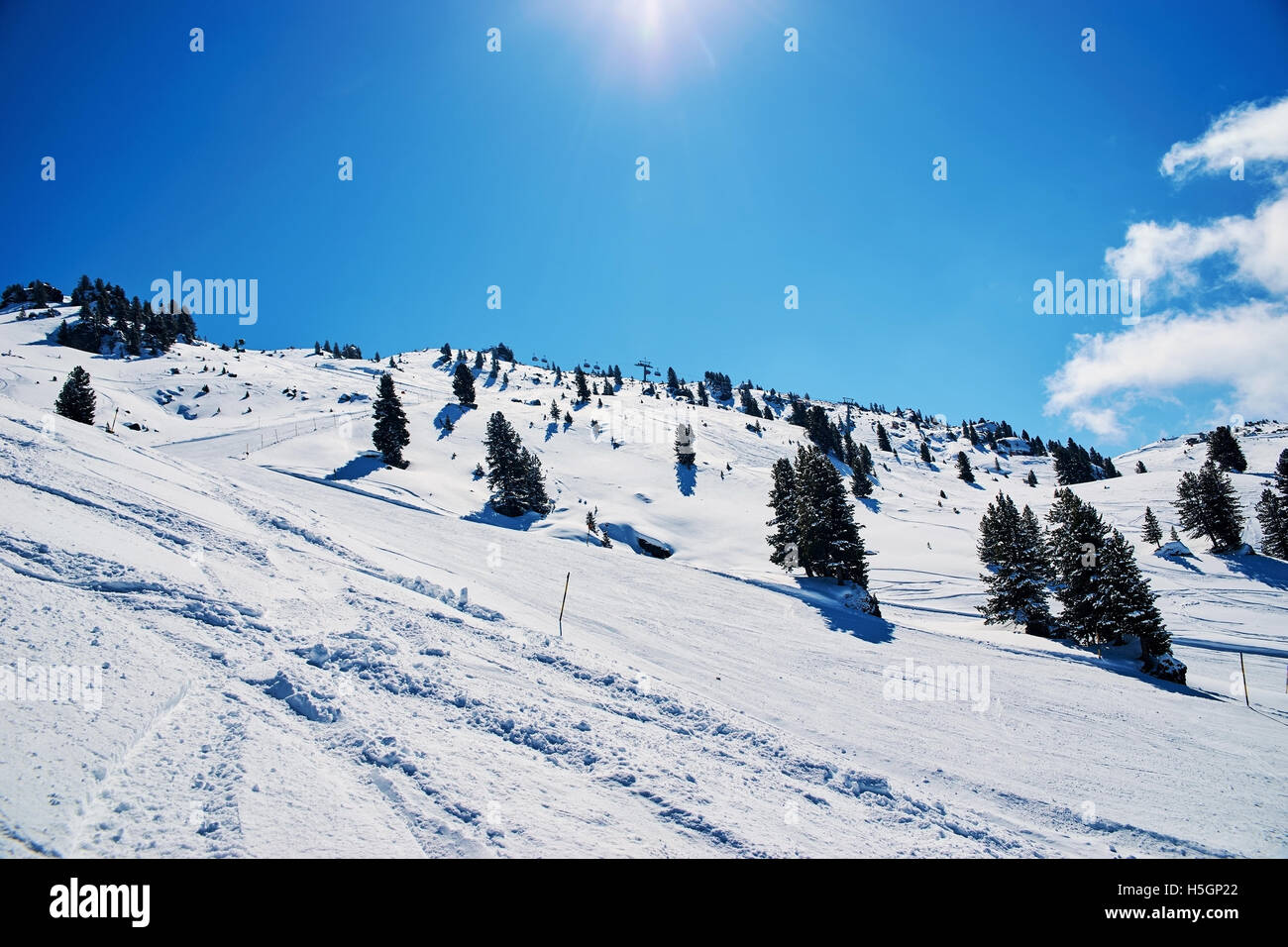 Snowy slopes in winter mountains. Skiing resorts Stock Photo - Alamy