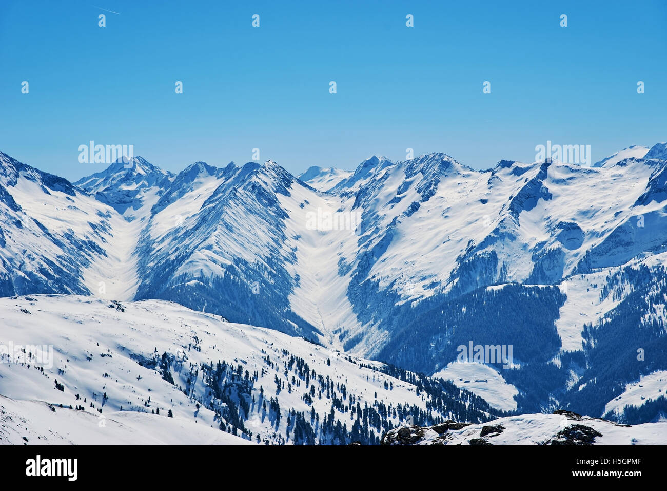 Snowy slopes in winter mountains. Skiing resorts Stock Photo - Alamy