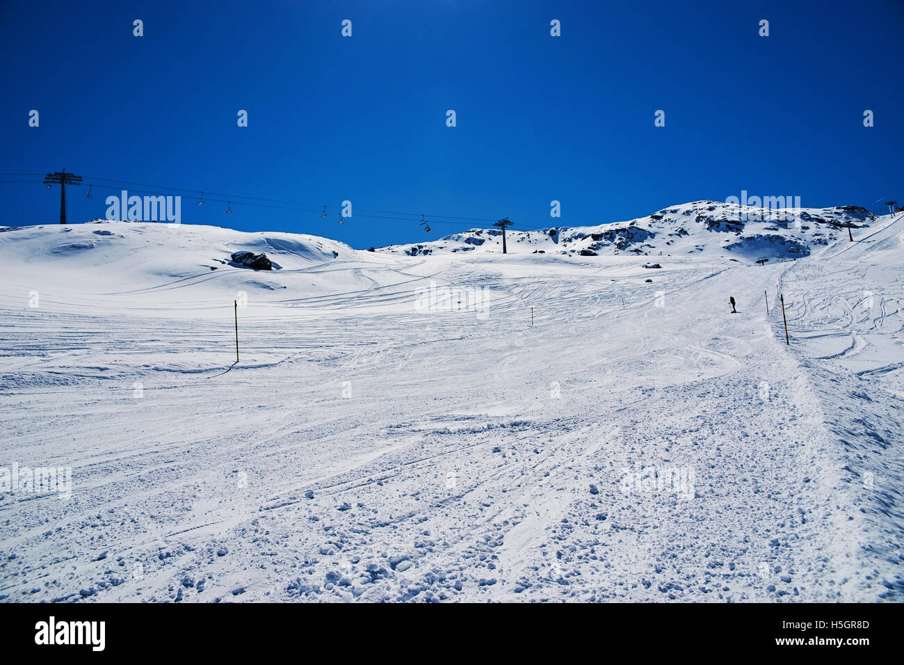 Snowy slopes in winter mountains. Skiing resorts Stock Photo - Alamy