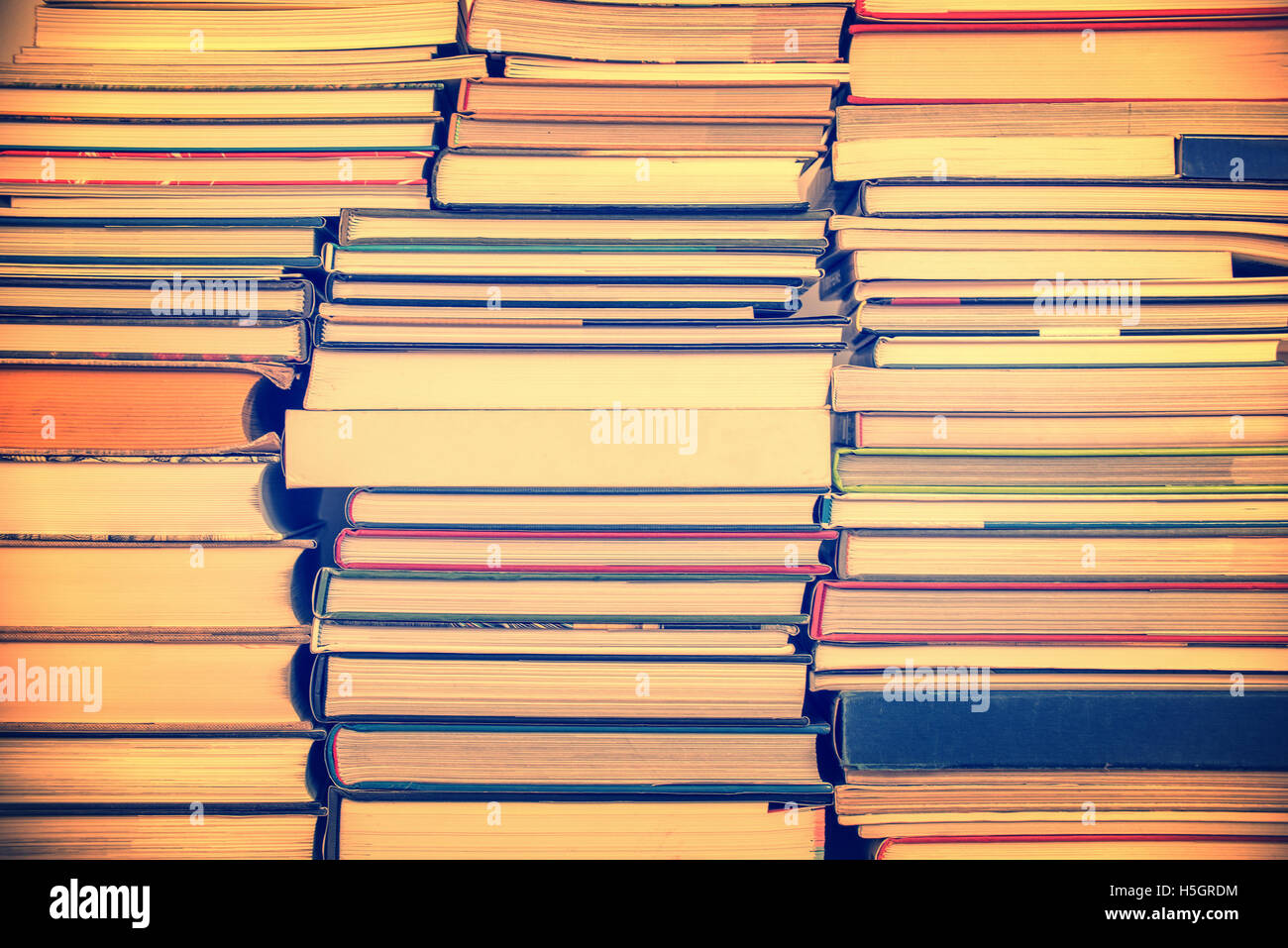 Piles of books background, vintage process Stock Photo - Alamy