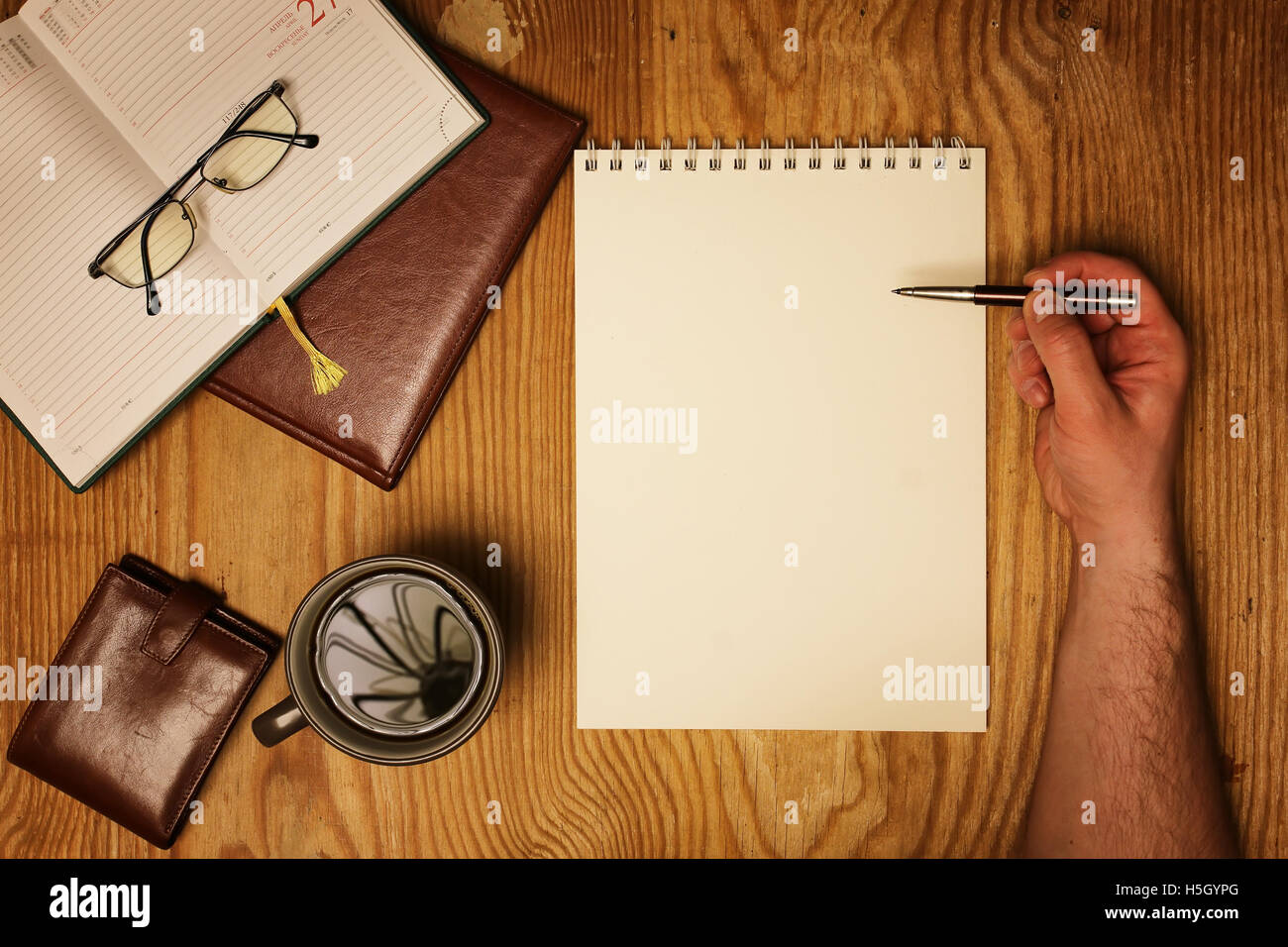 table write hand office view Stock Photo - Alamy