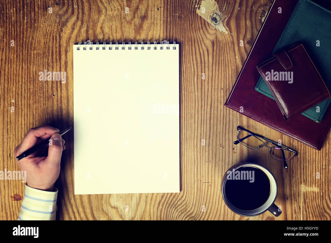 toned table write hand top view Stock Photo - Alamy