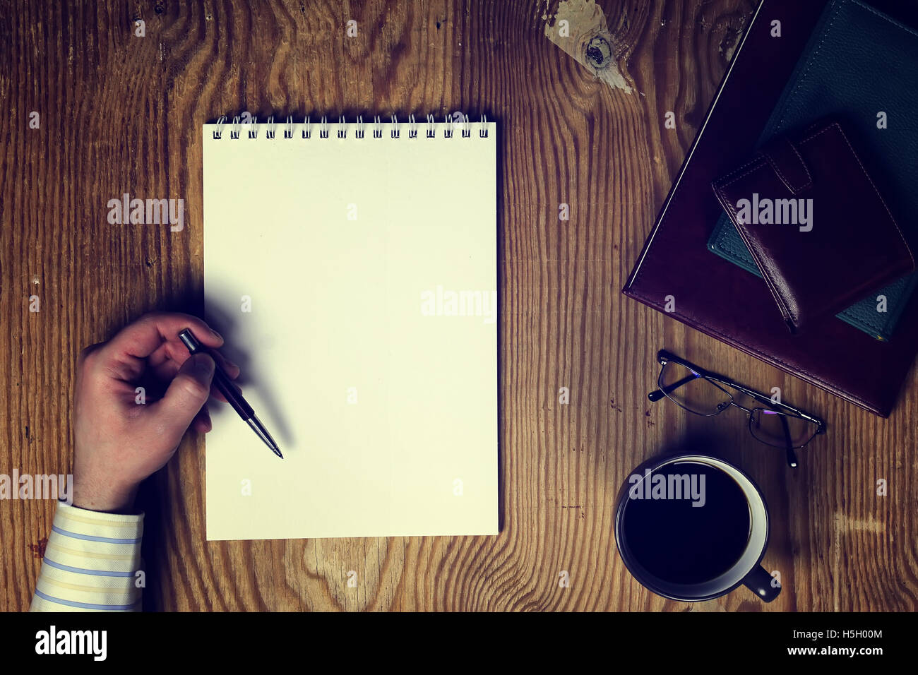 toned table write hand top view Stock Photo - Alamy