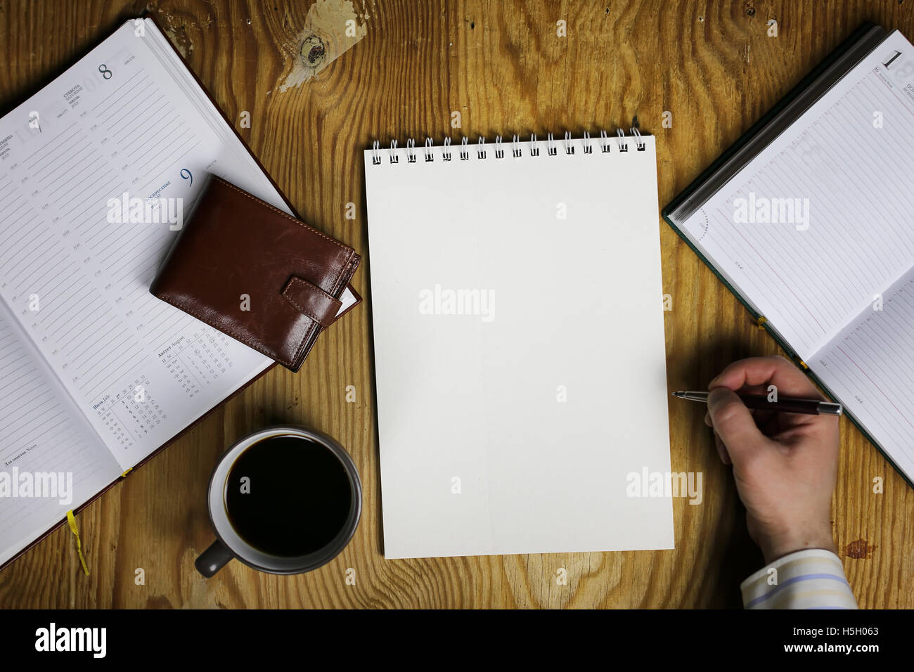 table write hand office view Stock Photo - Alamy