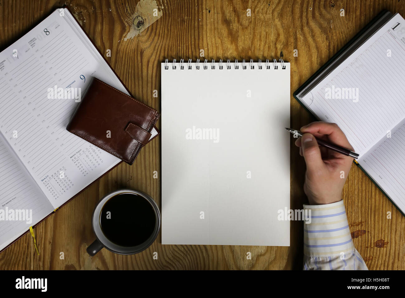 table write hand office view Stock Photo - Alamy