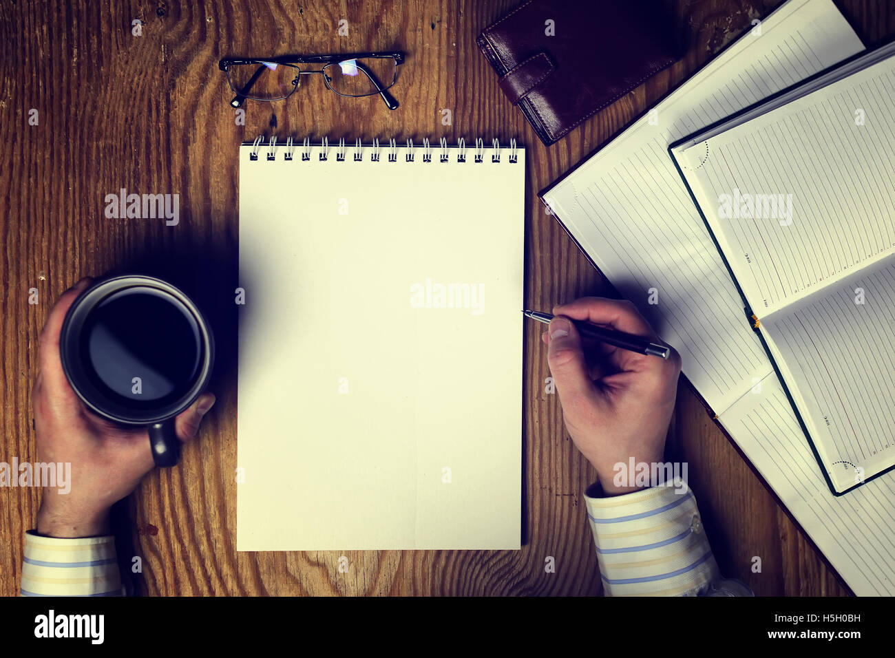 toned table write hand top view Stock Photo - Alamy