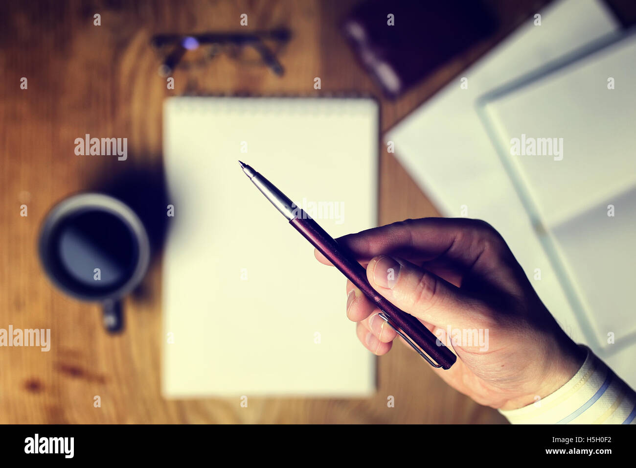 toned table write hand top view Stock Photo - Alamy