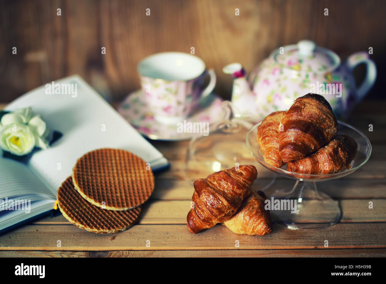 tea cup croissant book Stock Photo - Alamy