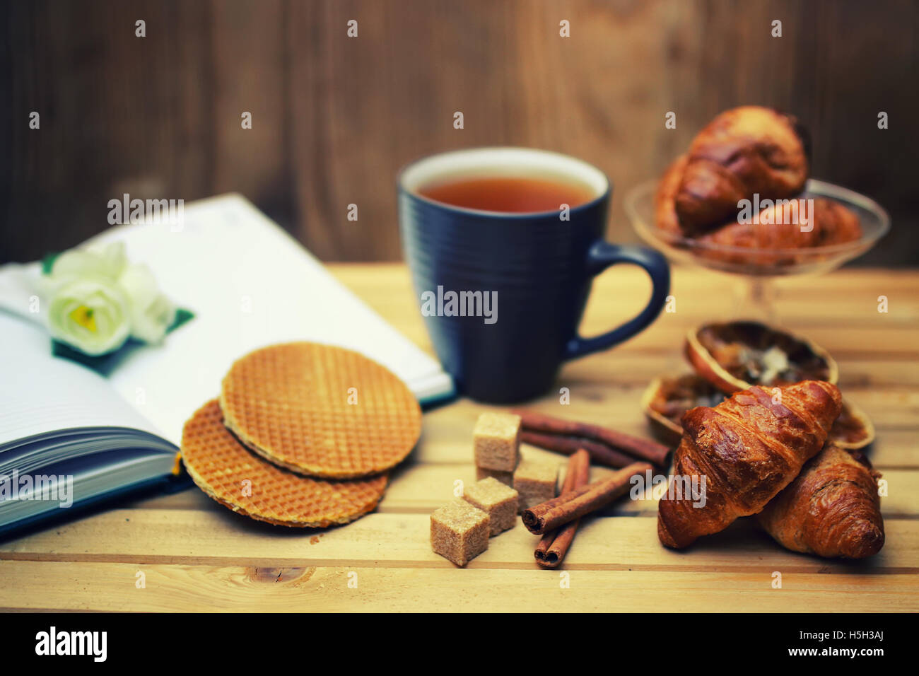 tea cup croissant book Stock Photo - Alamy