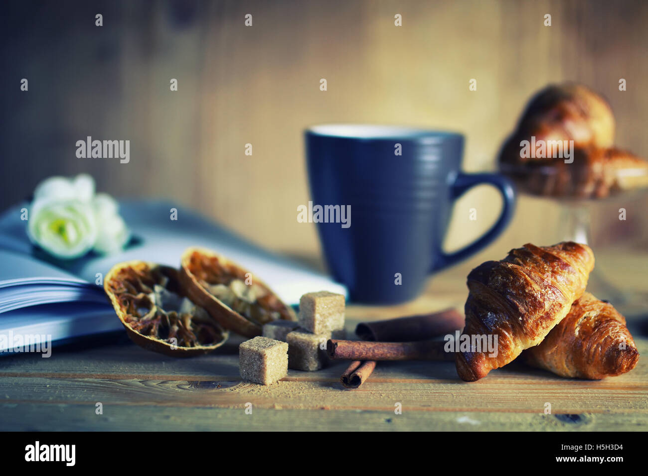tea cup croissant book Stock Photo - Alamy