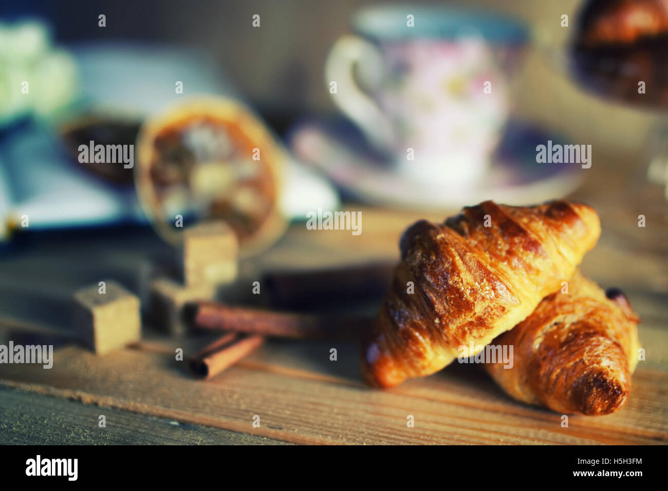 tea cup croissant book Stock Photo - Alamy