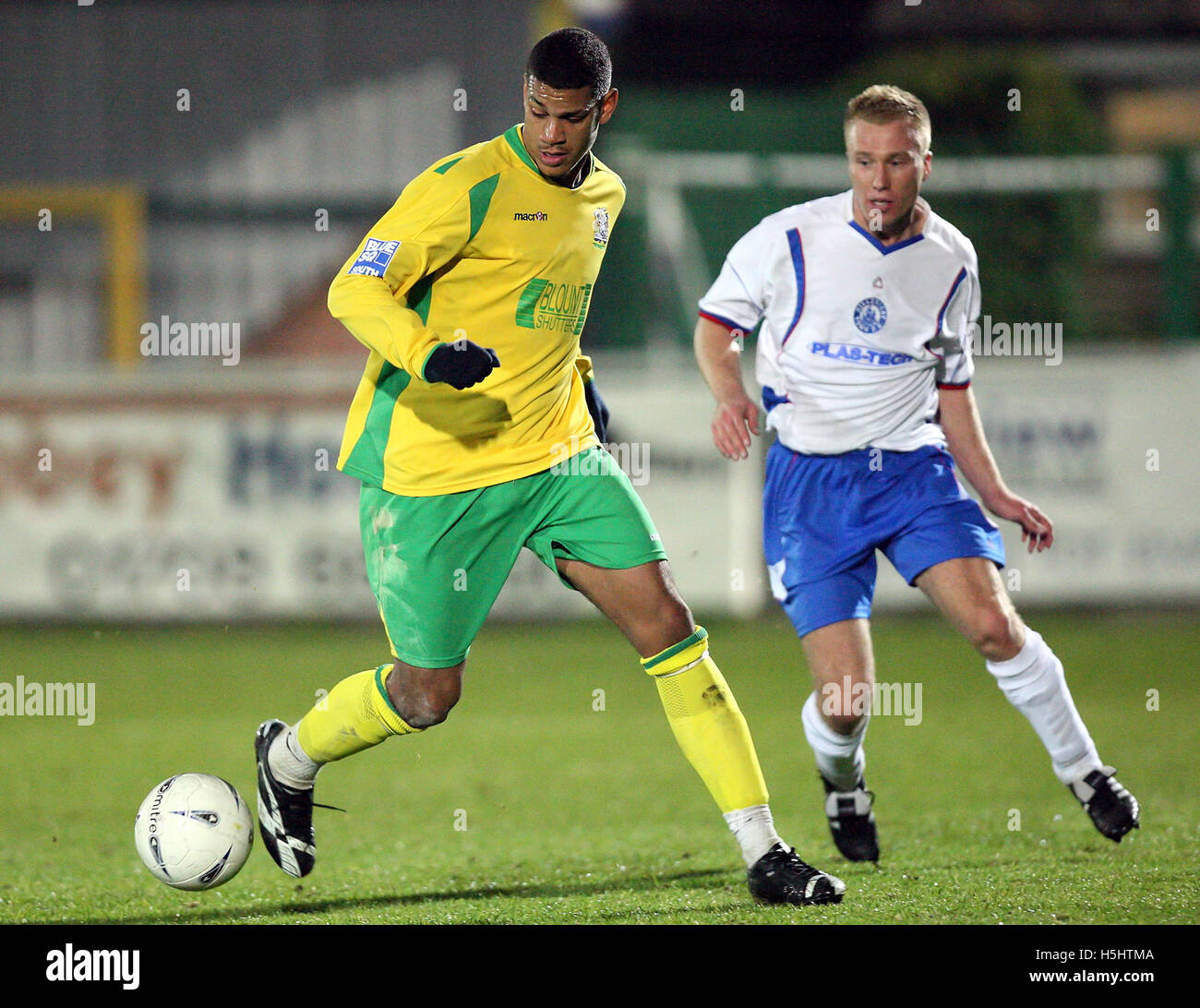Leon McKenzie of Thurrock shields the ball from Danny Kerrigan ...