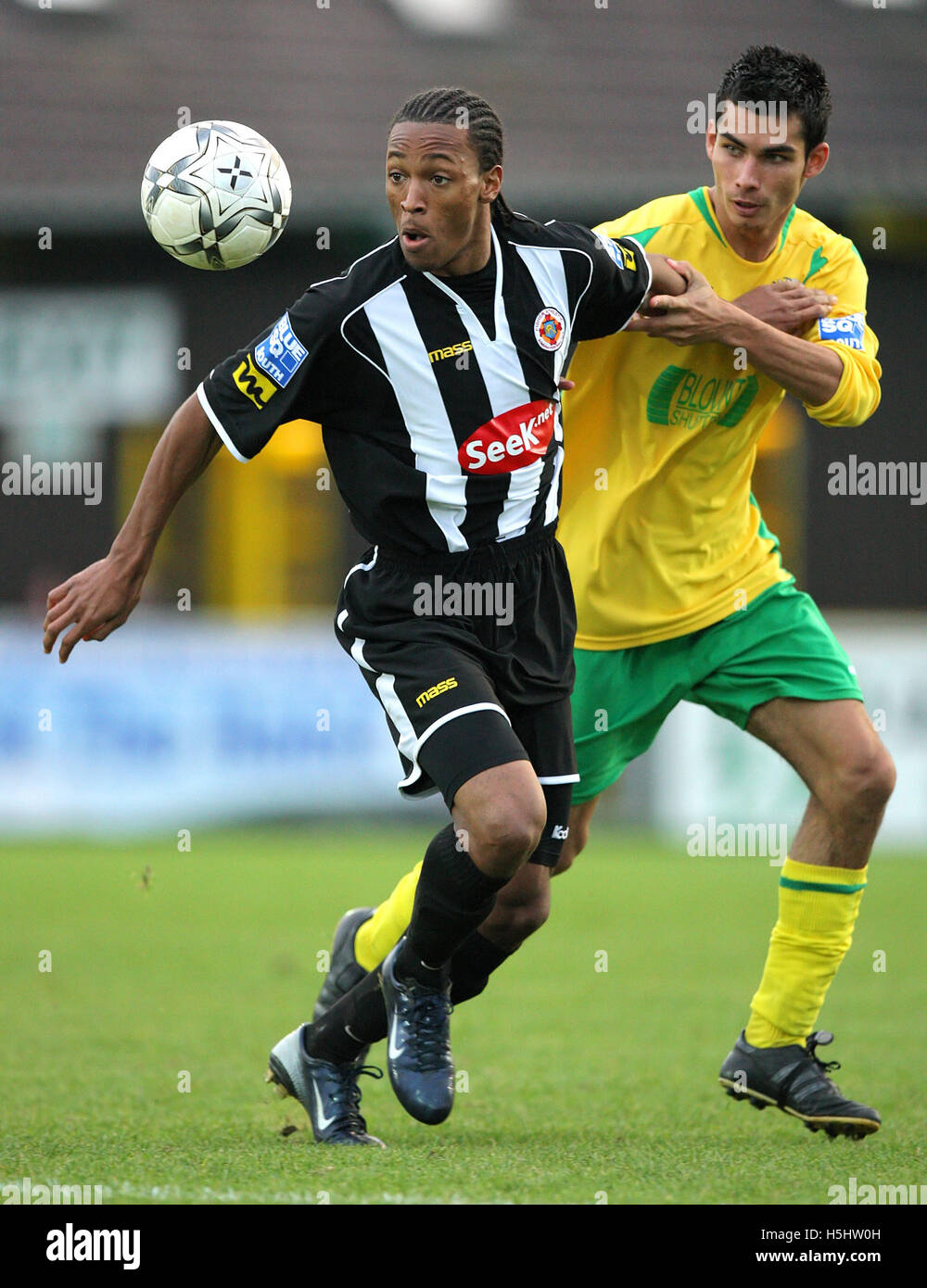 Wesley Thomas of Fisher shields the ball from Phil Anderson of Thurrock ...