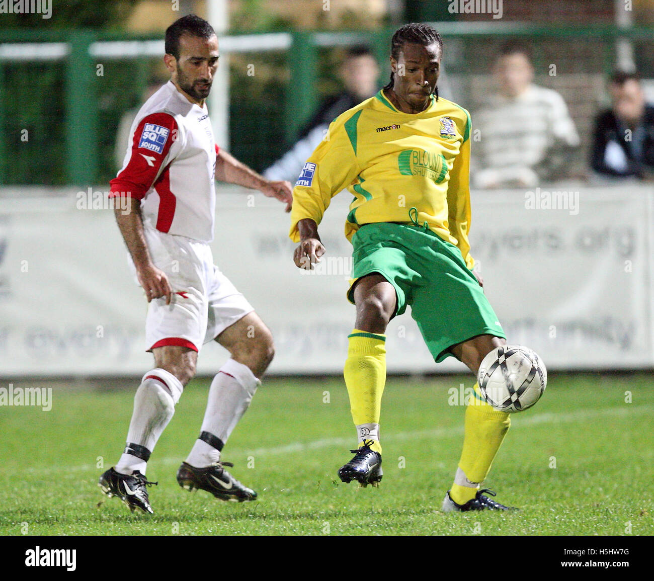 Wes Thomas of Thurrock shields the ball from Marcello Fernandes of ...