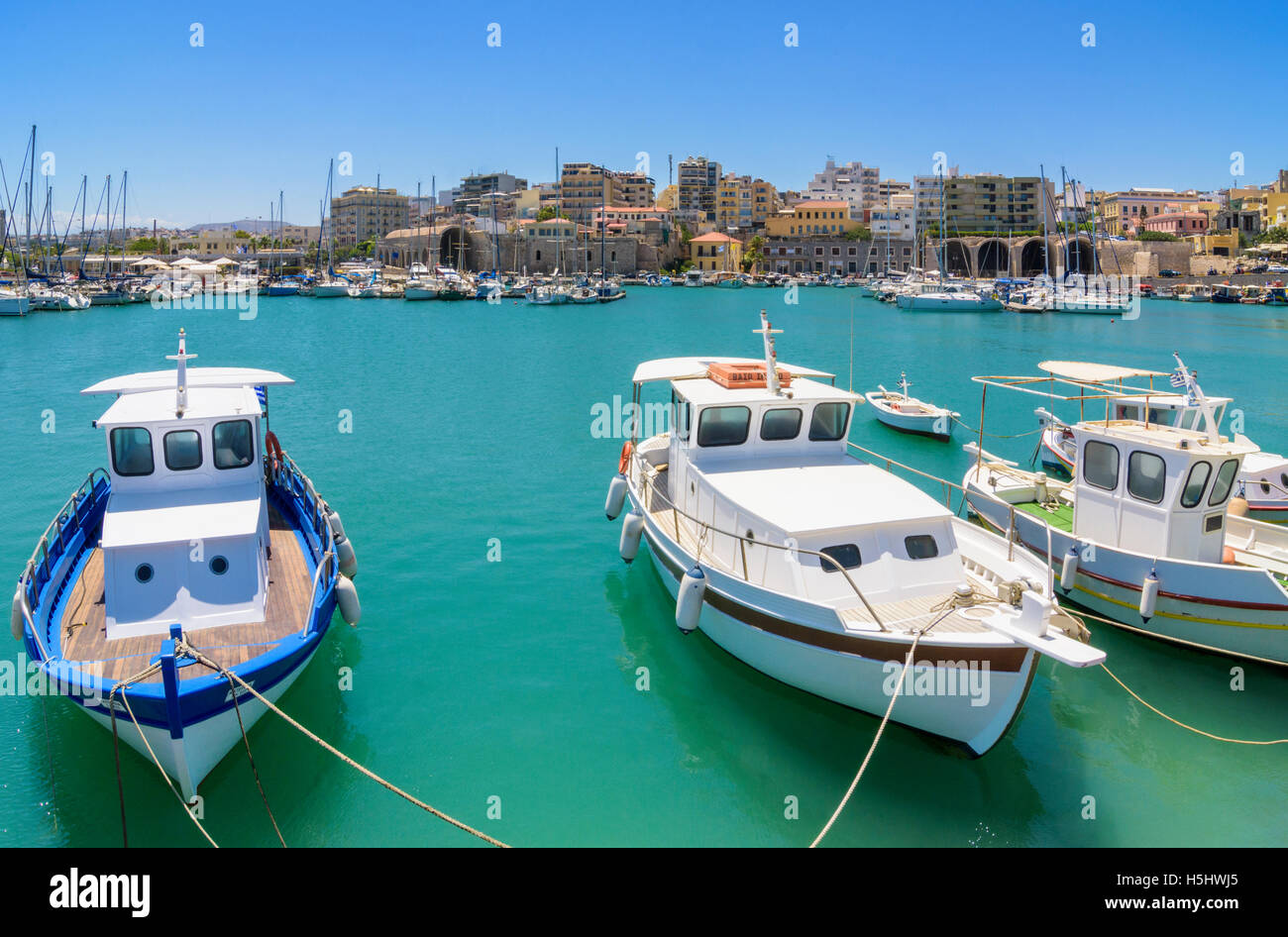 Moored fishing boats in the old Venetian Harbour of Heraklion, Crete ...