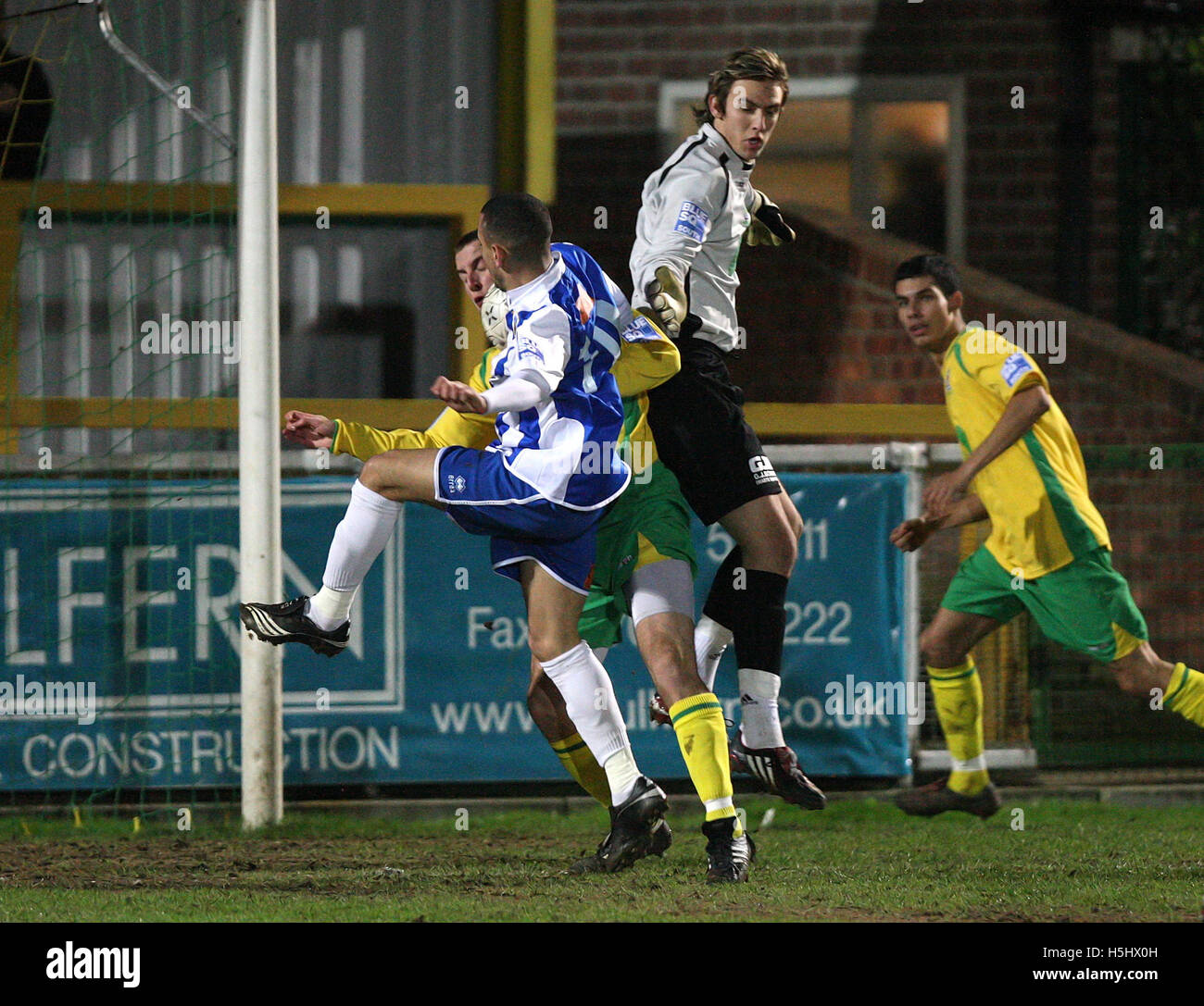 Craig Watkins of Havant creates a goal despite the attentions of Matt ...