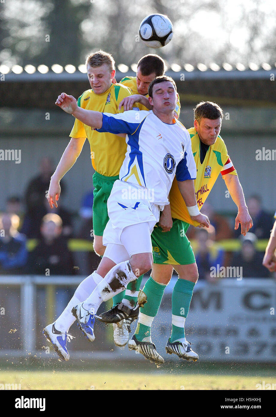 Danny Kedwell of Wimbledon rises with Hughes, Paine and Flynn of ...