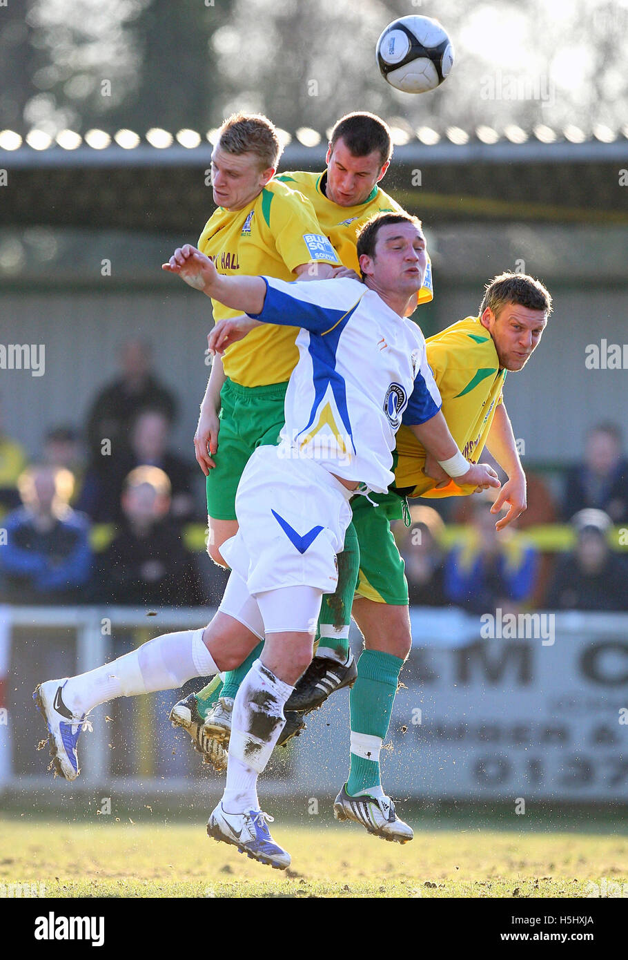 Danny Kedwell of Wimbledon rises with Hughes, Paine and Flynn of ...