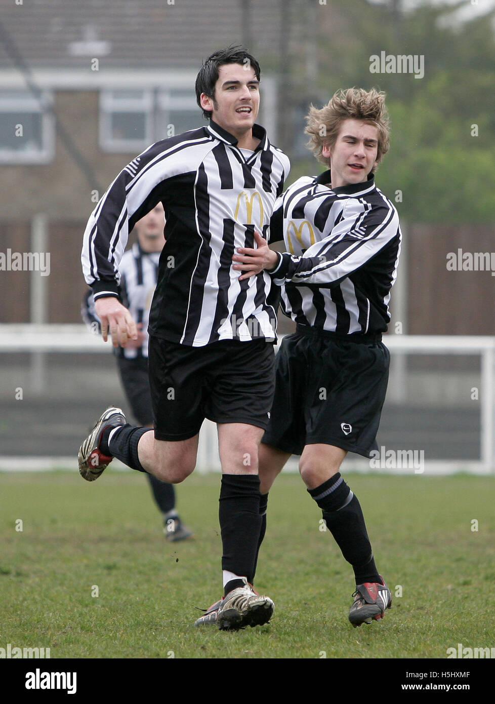 Tom Poole (left) scores the opening goal for Tilbury and celebrates ...
