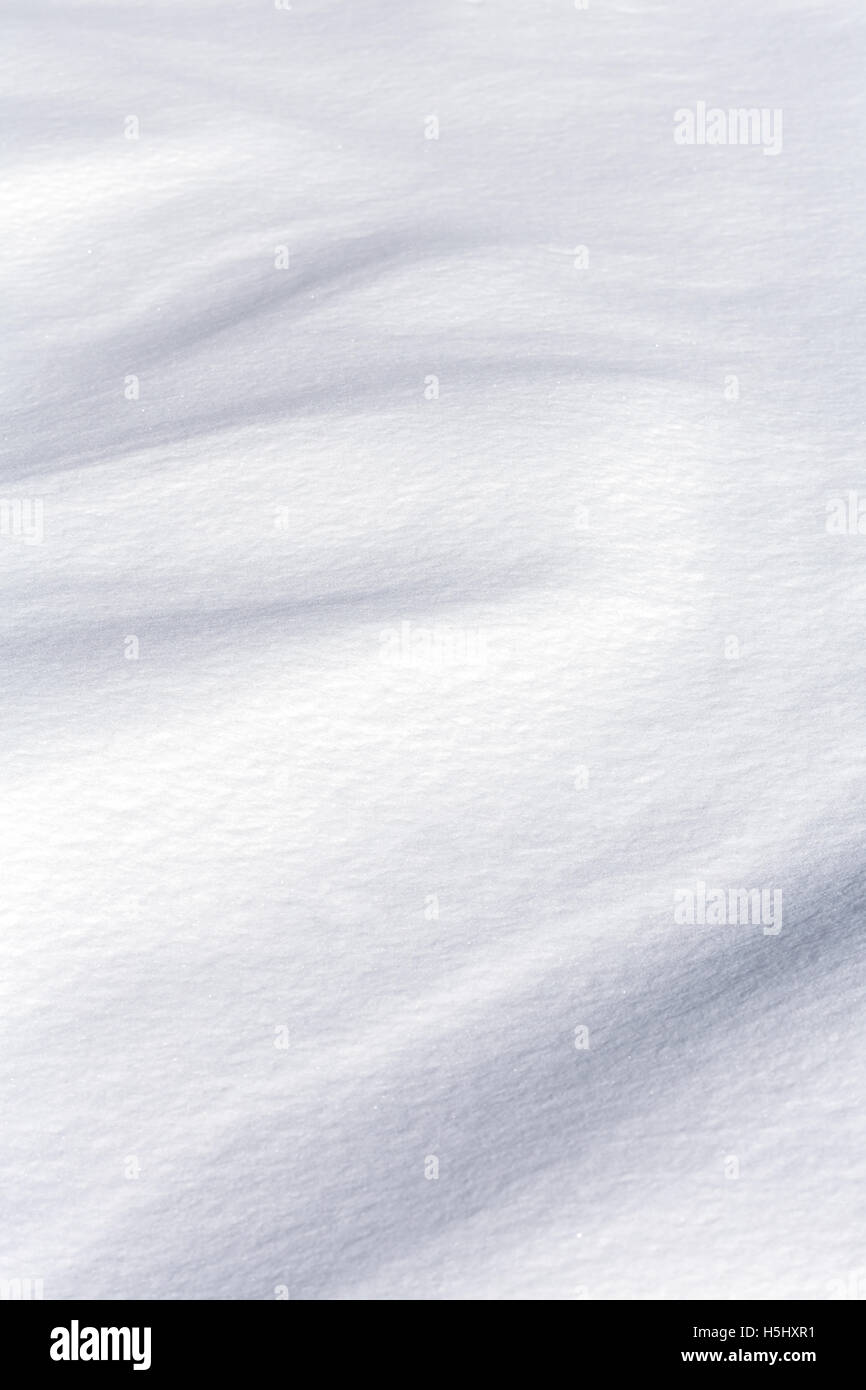 Wavy surface of pure white snow Stock Photo - Alamy