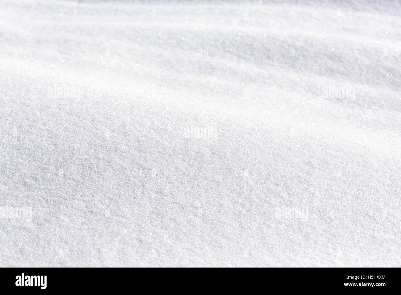 Wavy surface of pure white snow Stock Photo - Alamy