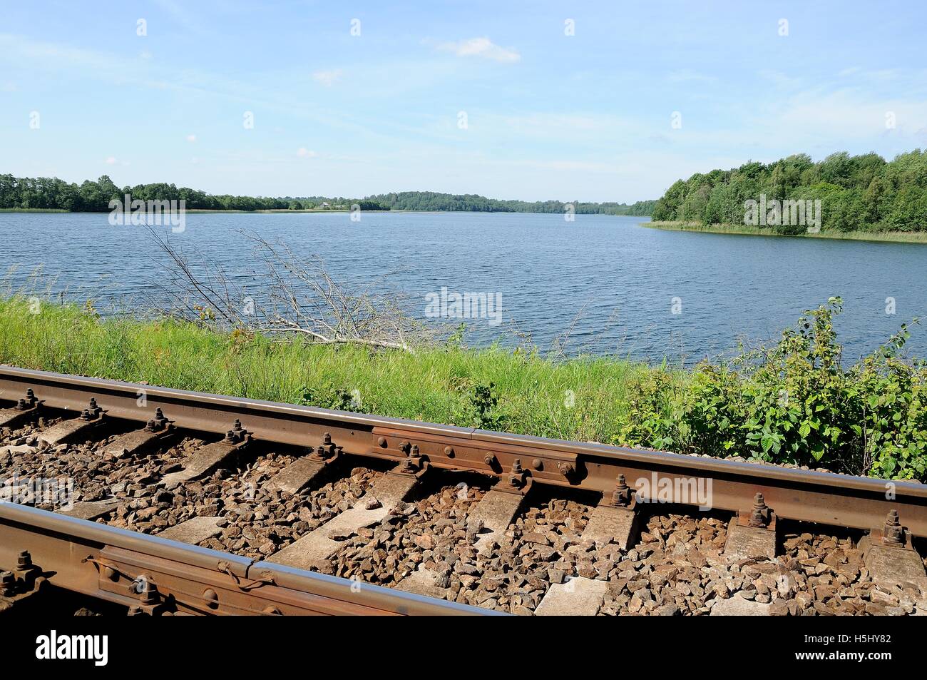 railway track along the coast of the beautiful lake Stock Photo - Alamy