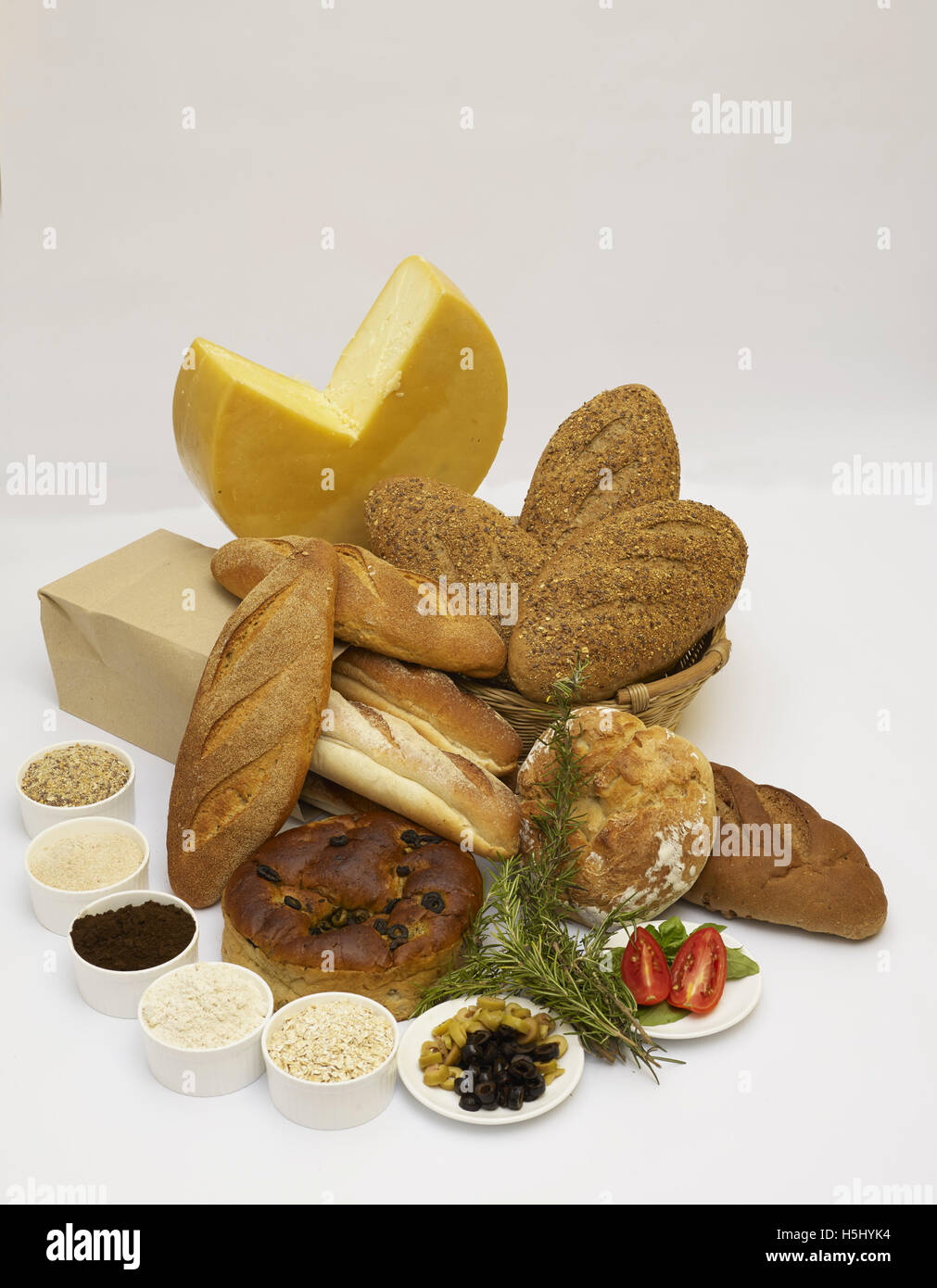 Assorted breads and cheese on a white background Stock Photo - Alamy