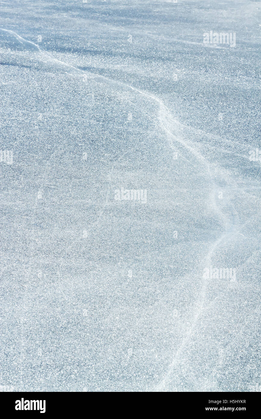 Frozen river blue ice surface with cracks Stock Photo - Alamy