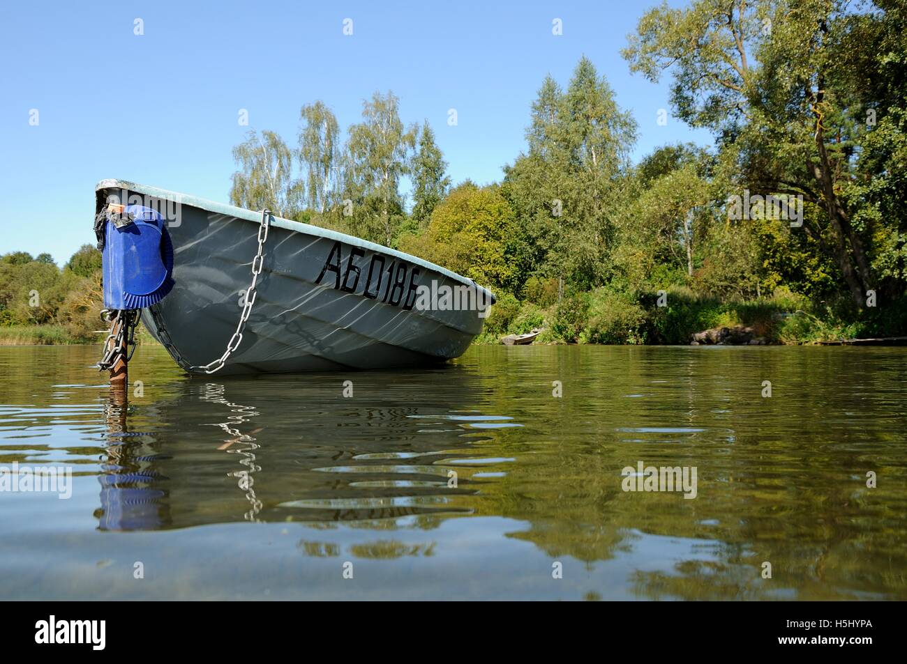 boat is moored by a chain to a column Stock Photo - Alamy