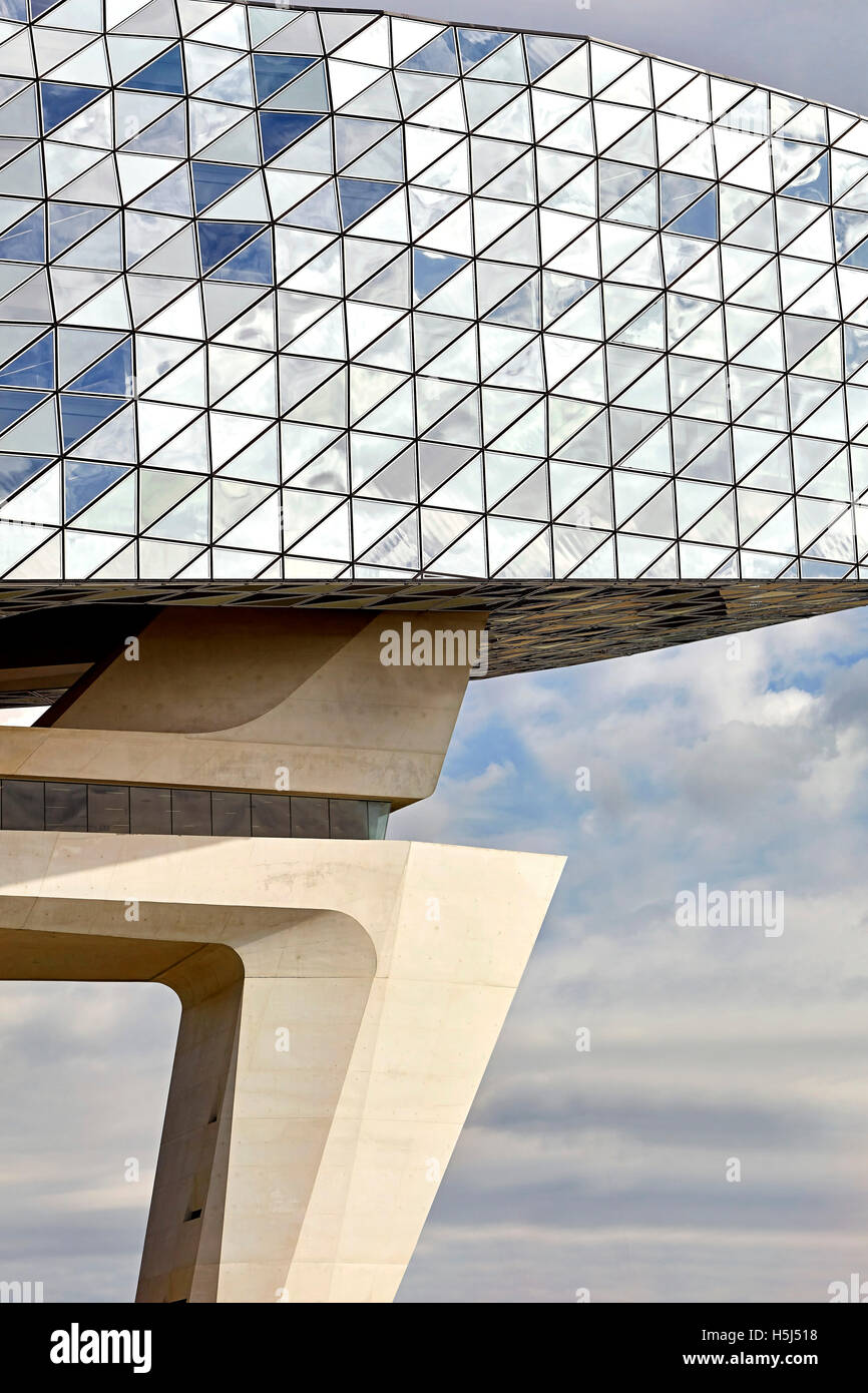 Concrete beam and triangular glass facets of exterior facade. Port ...