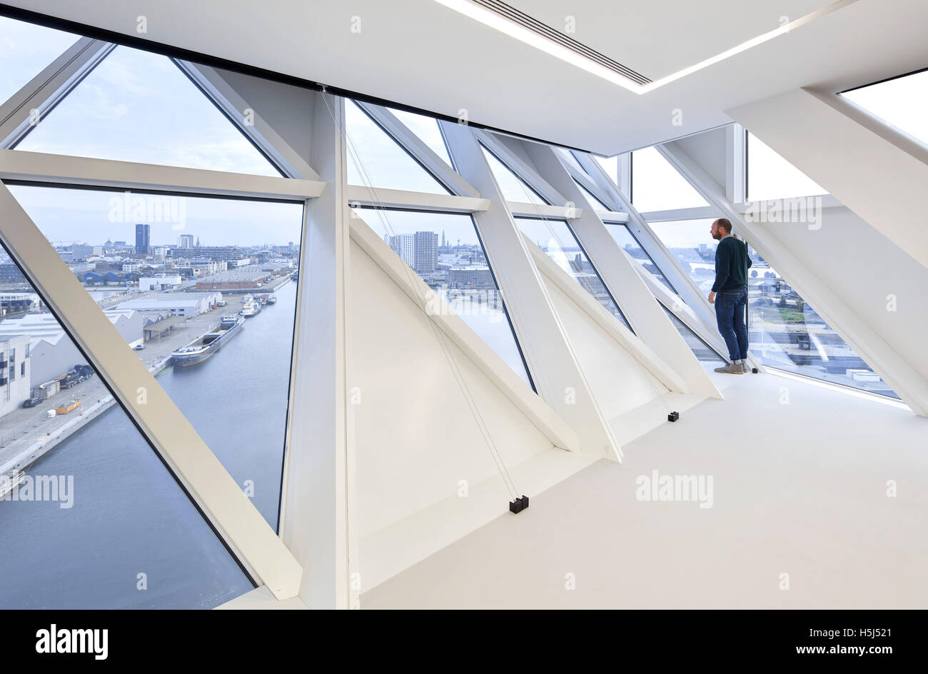Interior view through towards river and city. Port House, Antwerp ...