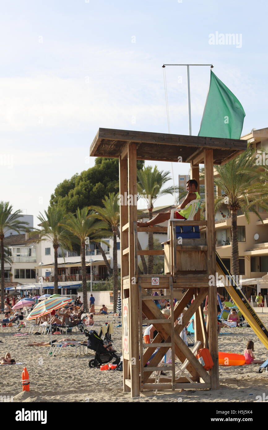 A lifeguard in a tower watches over the sea Stock Photo - Alamy