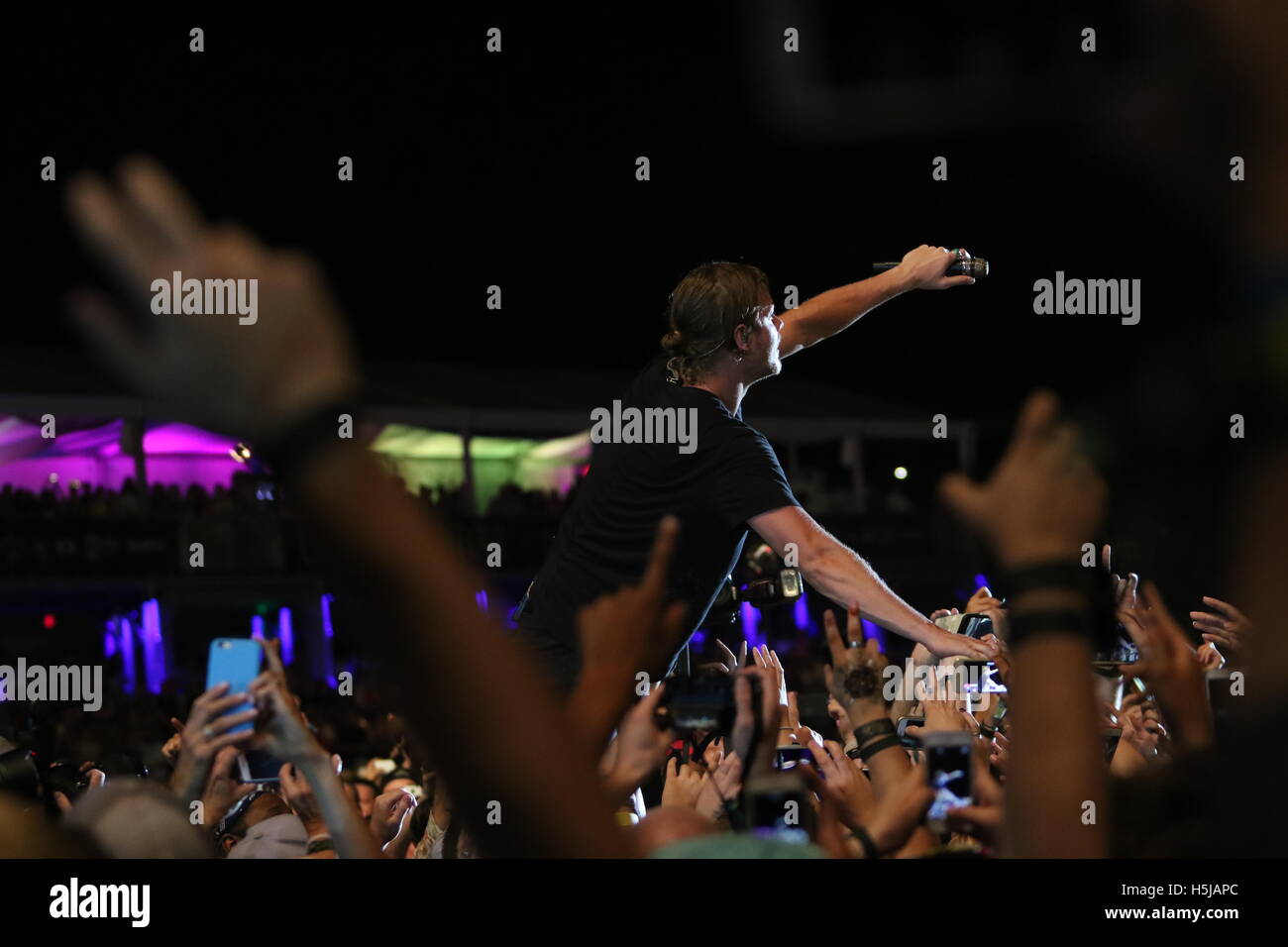 Singer Dan Reynolds of Imagine Dragons performs in the crowd at Life is ...