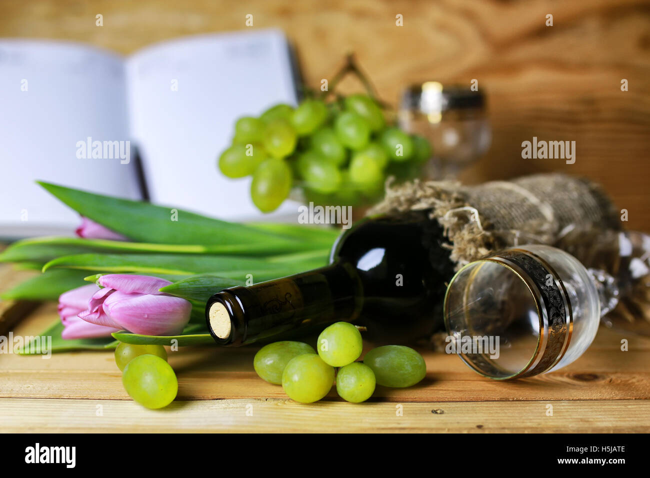 wine bottle book and glass grape Stock Photo - Alamy