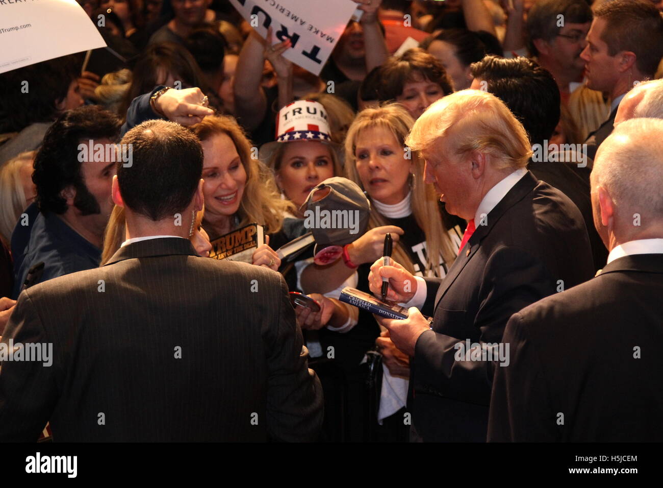 Donald J Trump signing autographs for his supporters at his Donald J ...