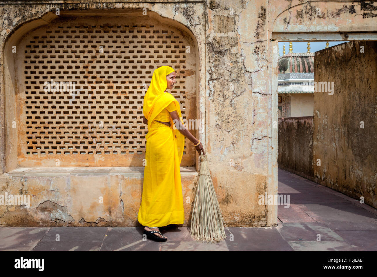 Environmental portrait of a woman janitor working on maintenance in ...