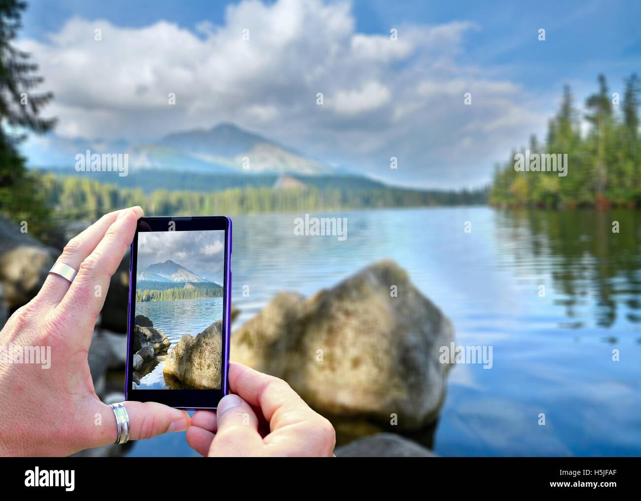 View over the mobile phone display during taking a picture of landscape ...