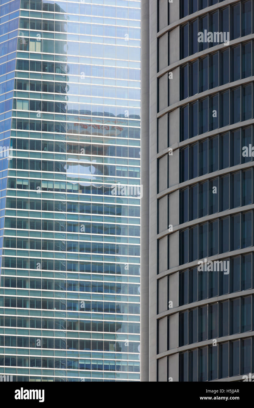 Modern metallic and glass building facades in financial area. Vertical ...
