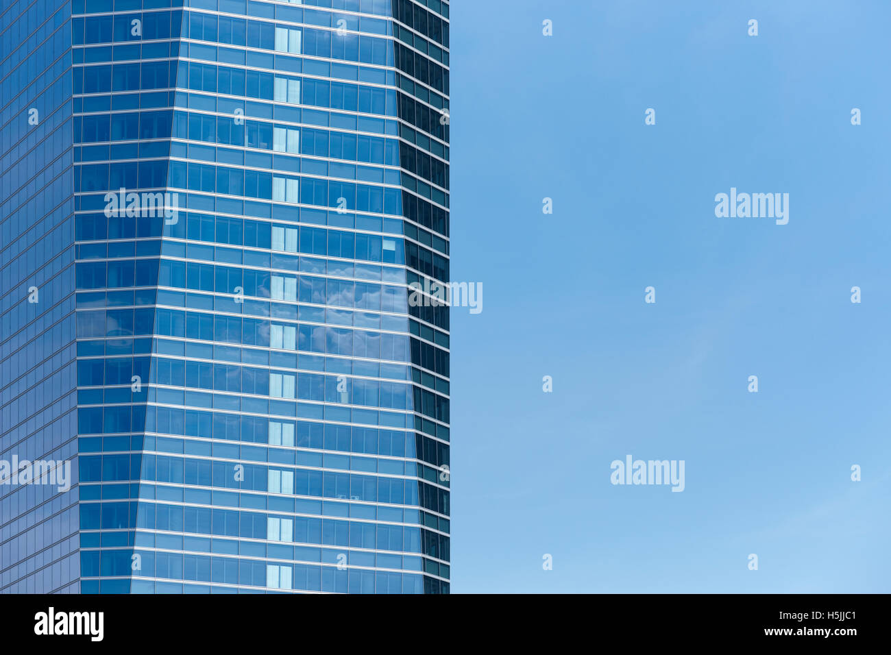 Modern metallic and glass building facade in blue tone. Horizontal ...